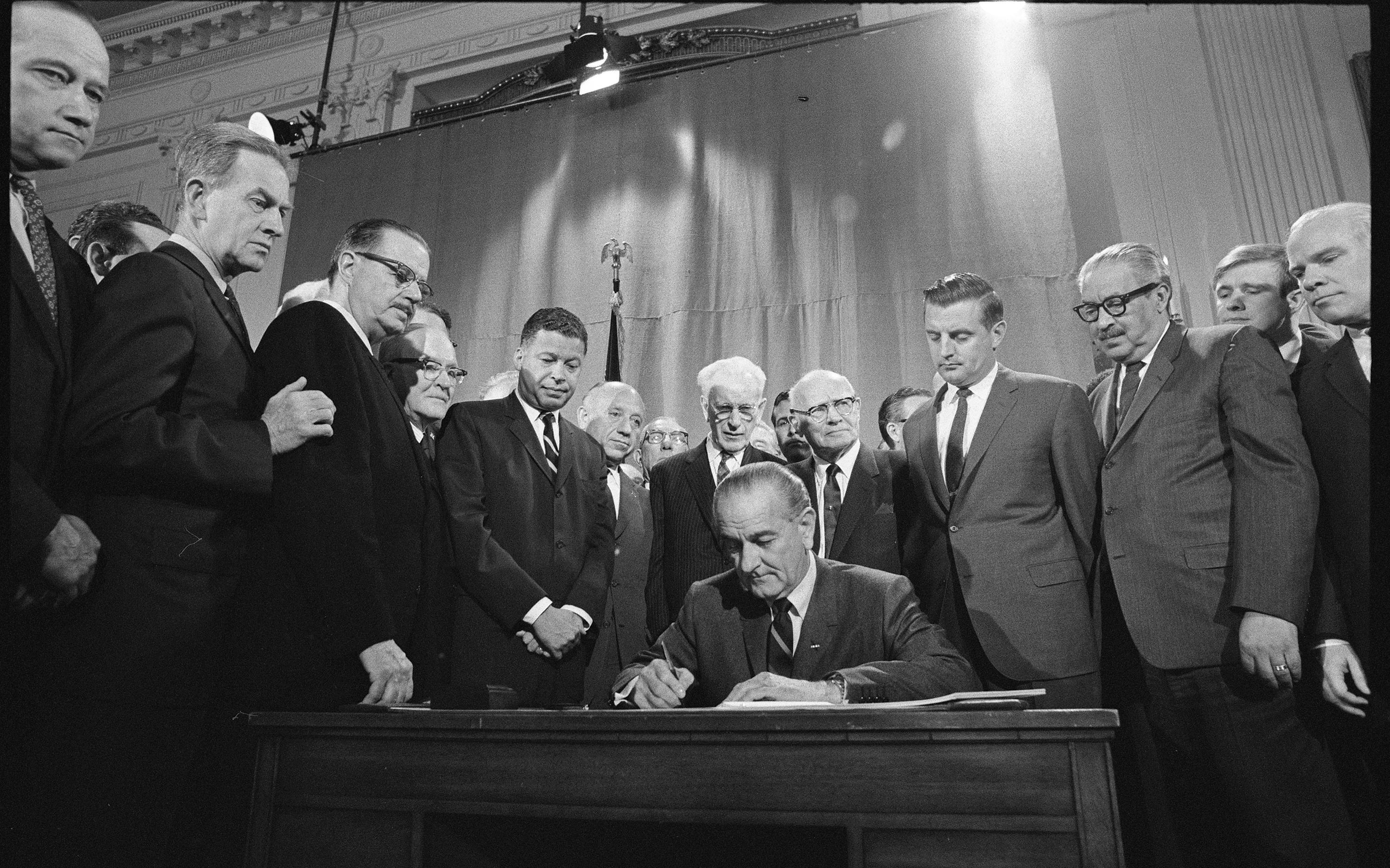 Photo - President Lyndon B. Johnson signs the Civil Rights Act of 1968 ...